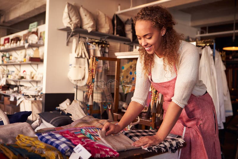 Female Sales Assistant in Clothing Store Stock Image - Image of small ...