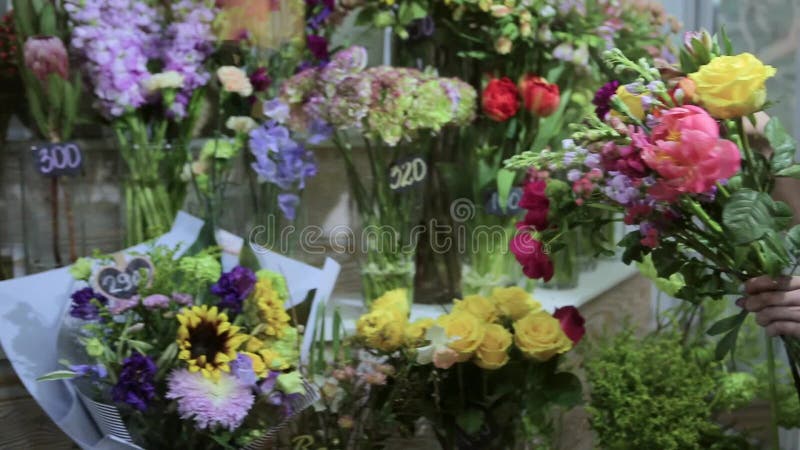 Female Sales Assistant Working As Florist and Picking a Bouquet Stock ...