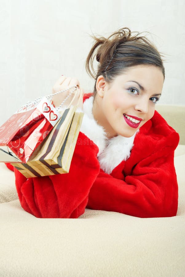 Female Santa with gift stock image. Image of girl, kringle - 17124235