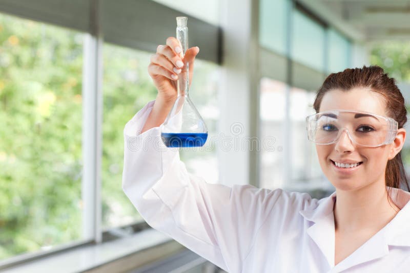 Female Science Student Looking at a Test Tube Stock Image - Image of ...