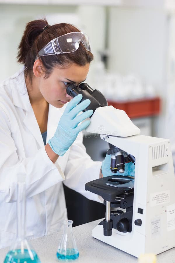 Female Scientific Researcher Using Microscope in Lab Stock Photo ...