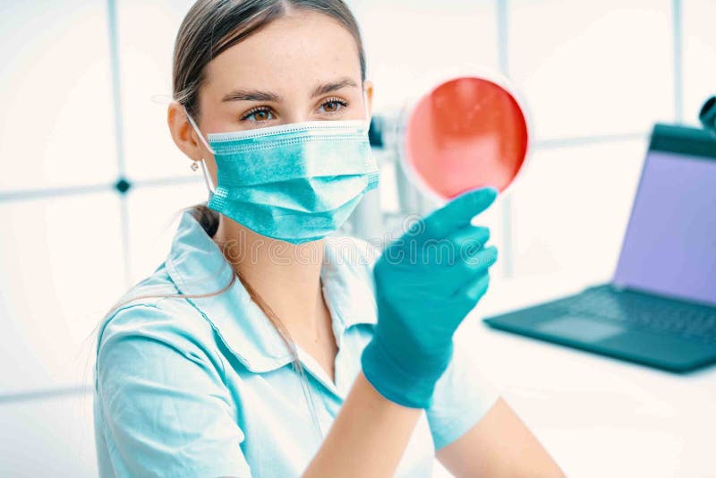 Female Laboratory Assistant in the Laboratory Examines River Water ...
