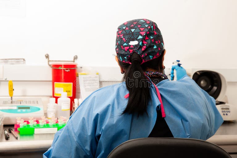 Female Scientist Extracting DNA Using the Spin Column-based Nucleic ...