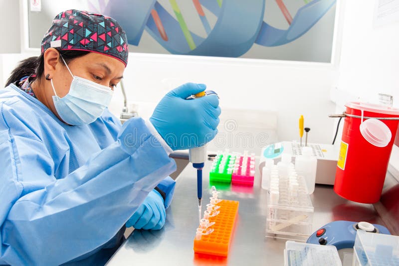 Female Scientist Extracting DNA Using the Spin Column-based Nucleic ...