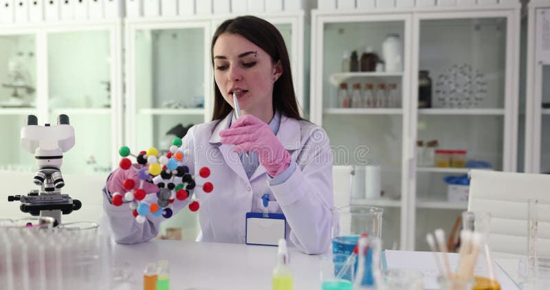 Female Scientist Holds Explaining Colorful Molecular Model Stock Video ...