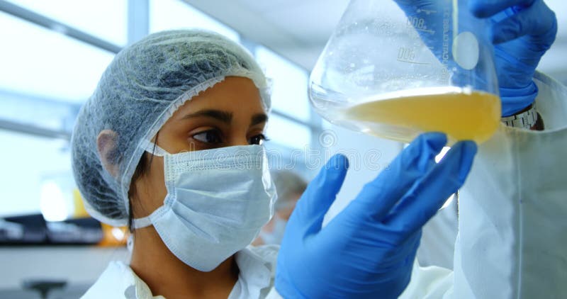 Female Scientist Looking at Conical Flask 4k Stock Video - Video of ...