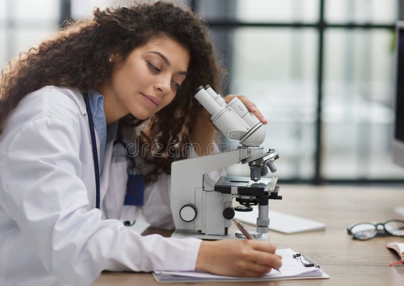 Female Scientist Researcher Conducting an Experiment in a Labora Stock ...