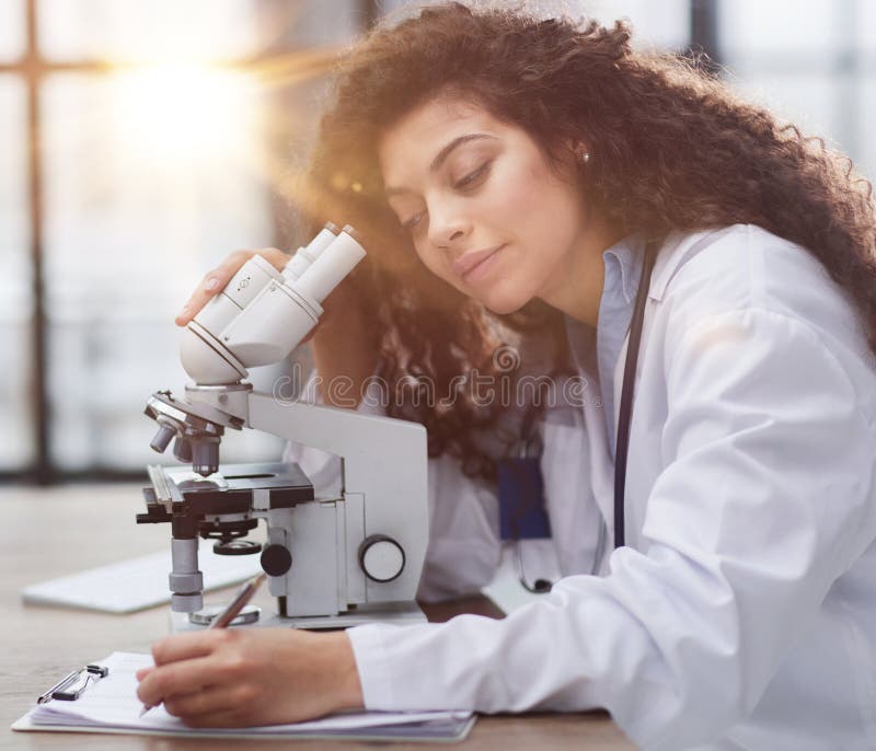 Female Scientist Researcher Conducting an Experiment in a Labora Stock ...