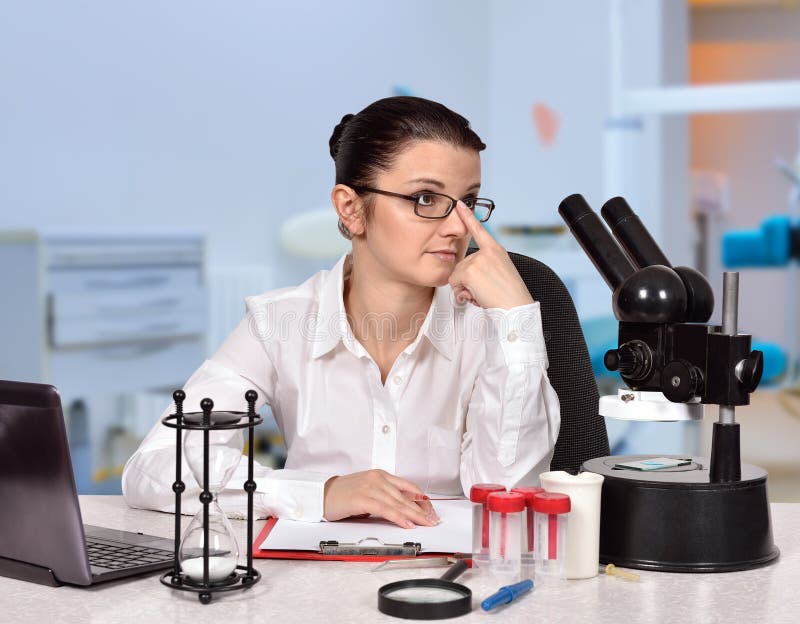 Female Scientist Sitting in Laboratory Stock Photo - Image of ...