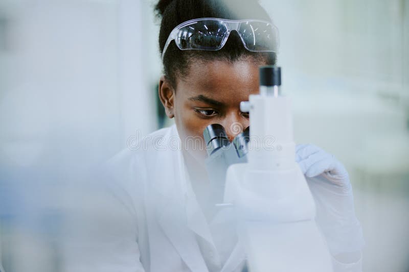 Female Scientist Using Advanced Microscope Equipment Stock Photo ...