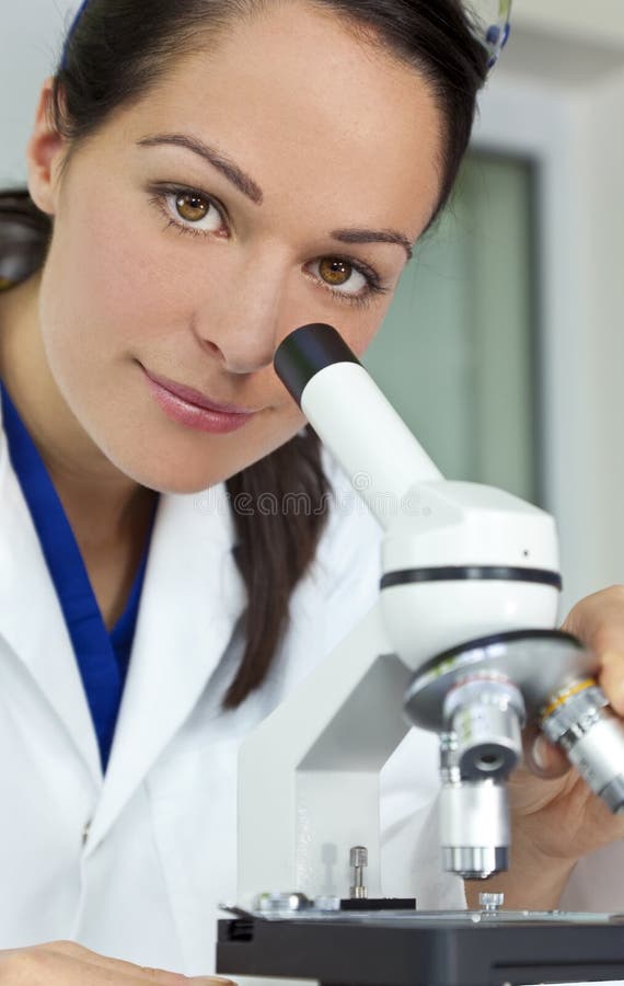 Female Scientist Using Microscope in Laboratory Stock Image - Image of ...