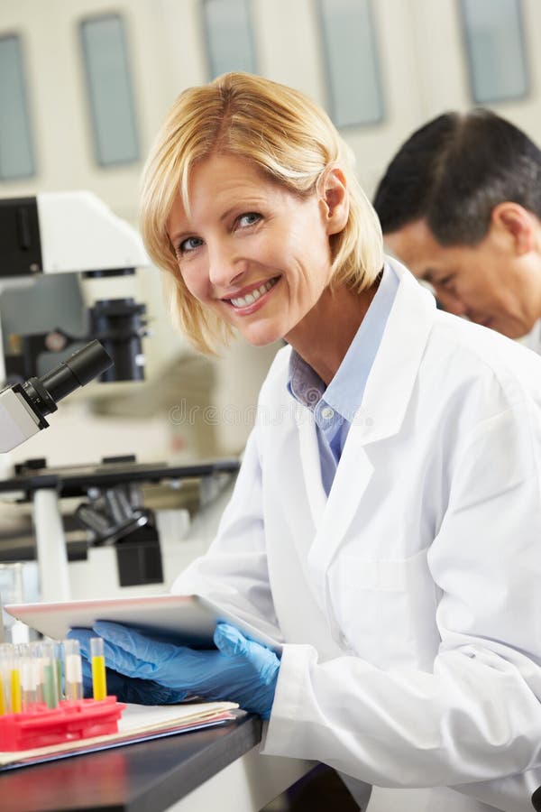 Research Scientist in Lab Coat Stock Photo - Image of looking, research ...
