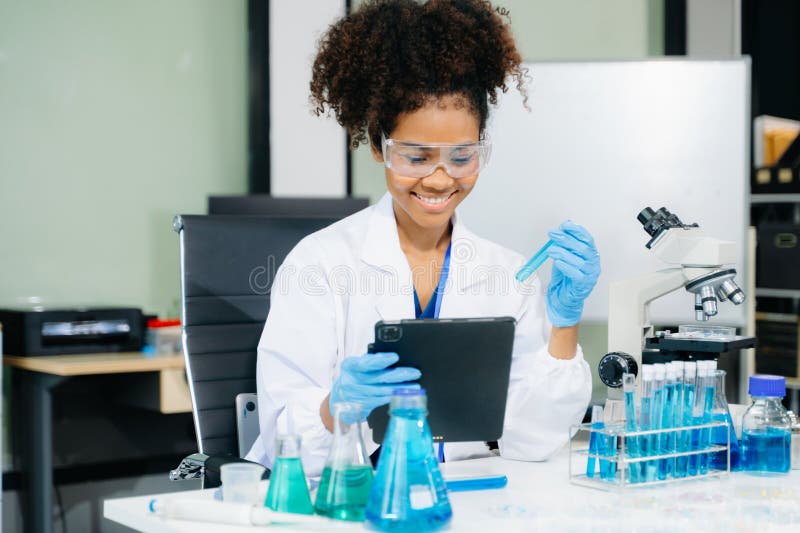 Female Scientist Working with Micro Pipettes Analyzing Biochemical ...