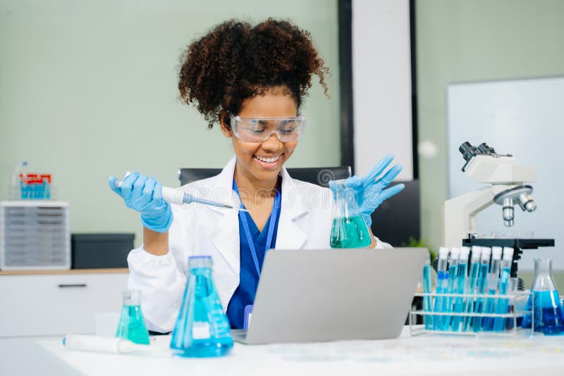 Female Scientist Working with Micro Pipettes Analyzing Biochemical ...