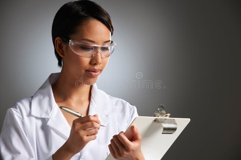 Female Scientist Writing on Clipboard Stock Image - Image of research ...