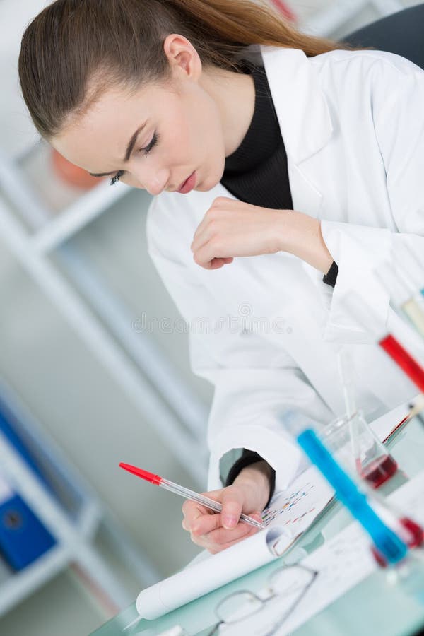 Female Scientist Writing Notes from Experiment Stock Photo - Image of ...