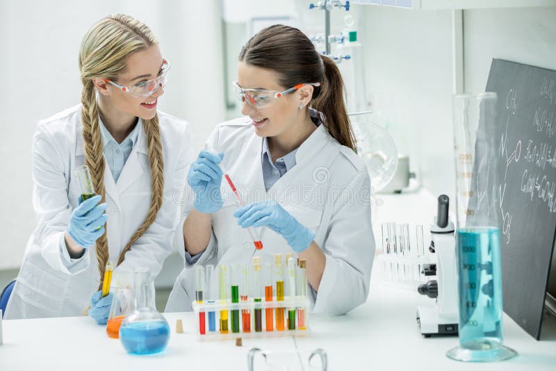 Female scientists in lab stock photo. Image of scientists - 90100426