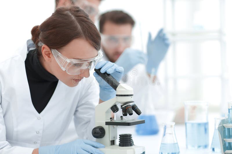 Female Scientists Looking into a Microscope Stock Image - Image of ...