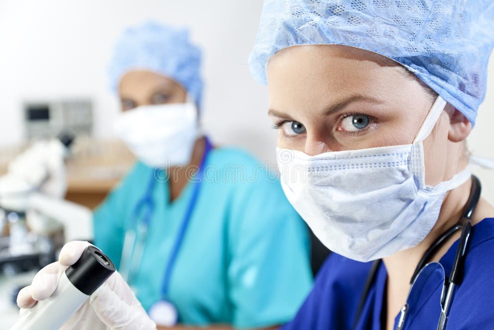 Female Scientists Using Microscopes in Laboratory Stock Image - Image ...