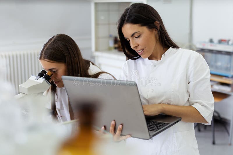Female Scientists Working in a Modern Laboratory Setting Stock Image ...