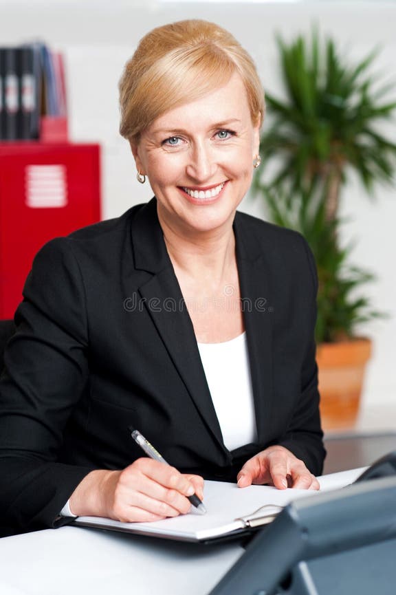 Female Secretary Writing on Notepad Stock Photo - Image of documents ...