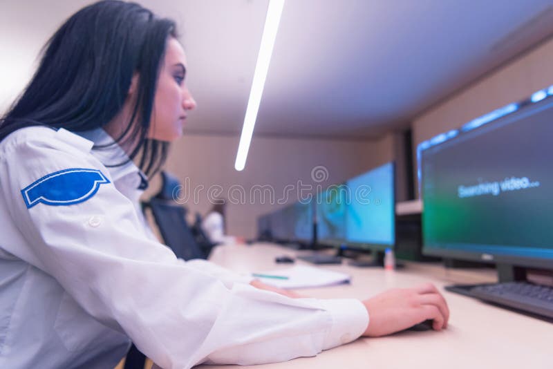 Female Security Guard Operator Talking on the Phone, Calling in the ...