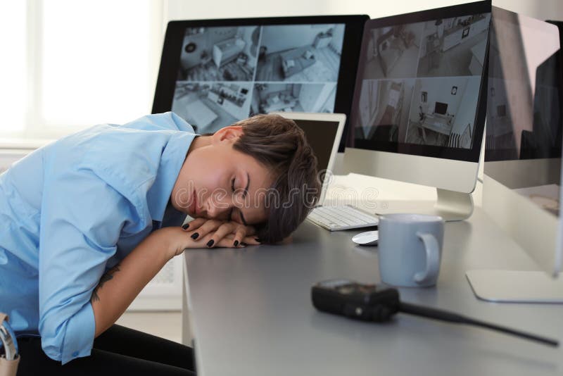 Female Security Guard Sleeping at Workplace Stock Image - Image of ...