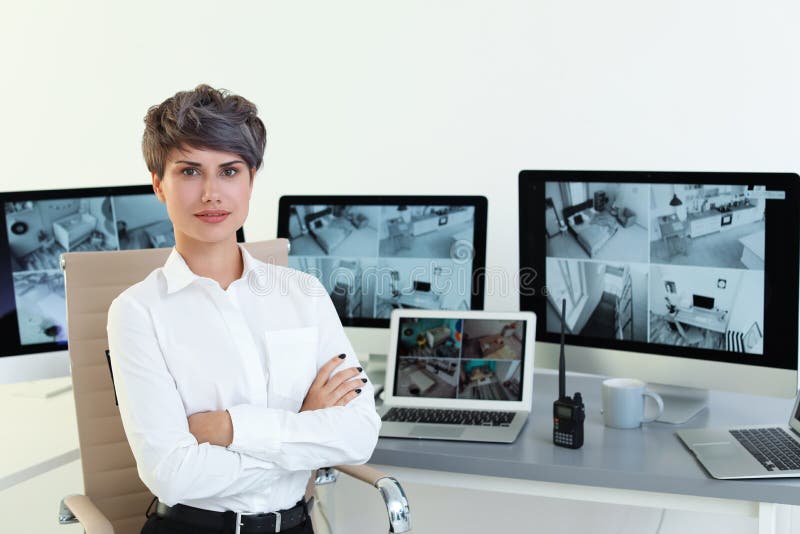 Female Security Guard at Workplace with Modern Computers Stock Photo ...