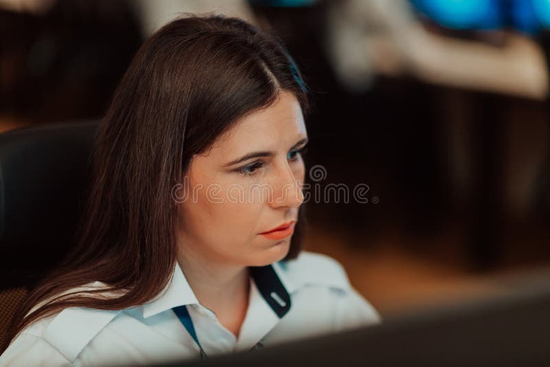 Female Security Operator Working in a Data System Control Room Offices ...