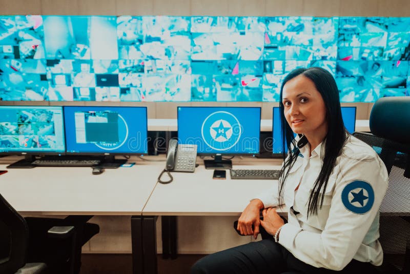 Female Security Operator Working in a Data System Control Room Offices ...