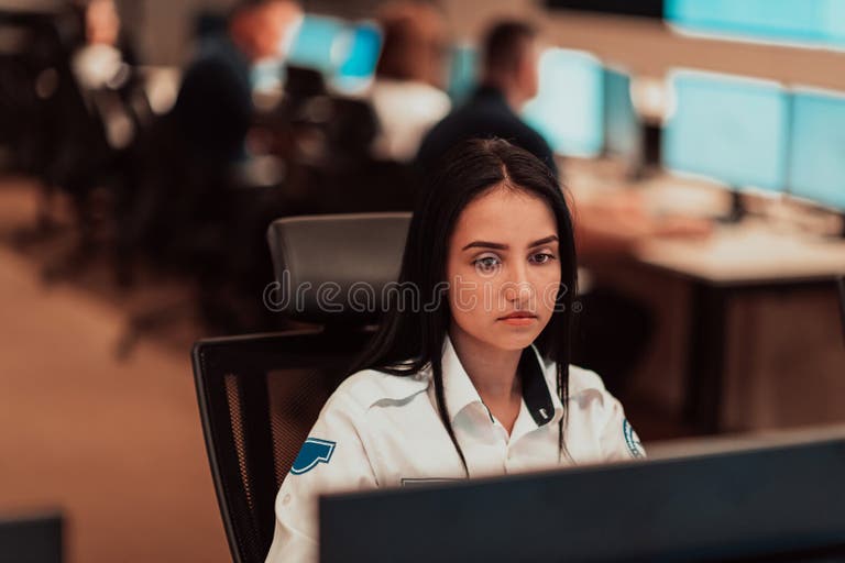 Female Security Operator Working in a Data System Control Room Offices ...