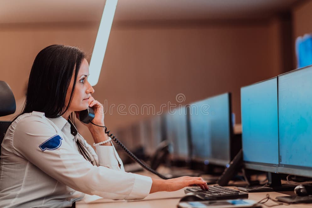 Female Security Operator Working in a Data System Control Room Offices Technical Operator ...