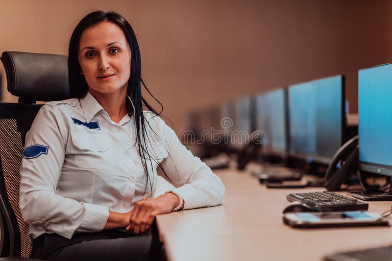 Female Security Operator Working in a Data System Control Room Offices ...
