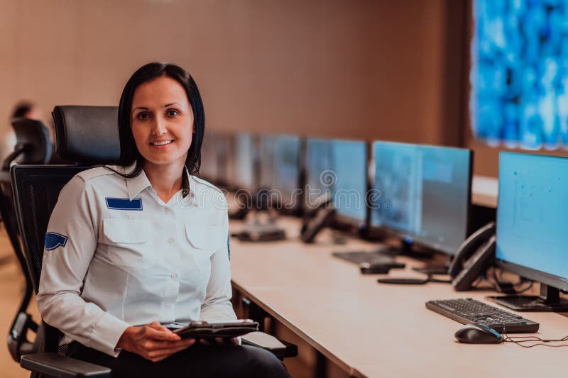 Female Security Operator Working in a Data System Control Room Offices ...