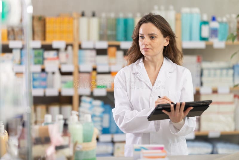 Female Seller Makes Notes on Electronic Tablet - Keeps Track of Receipt ...