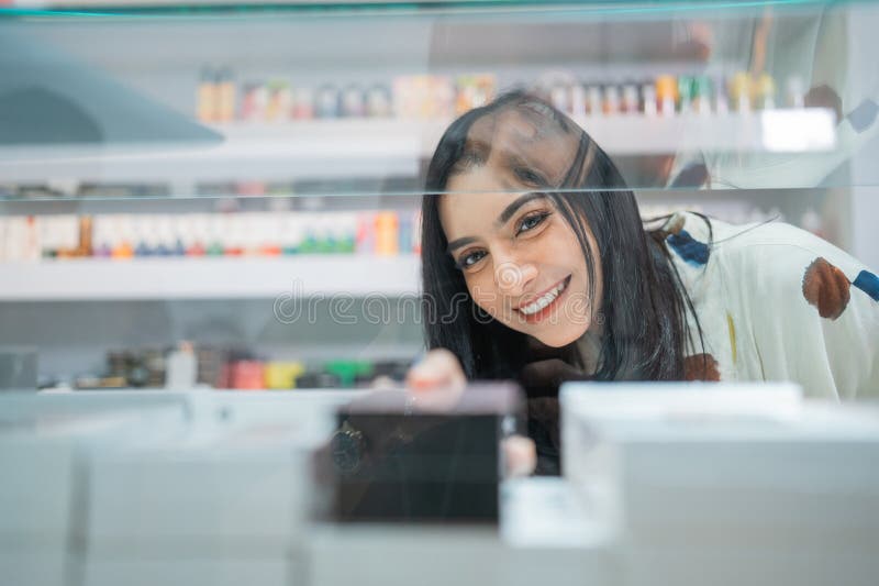 Female Seller Smiling while Taking the Vape Mod Stock Photo - Image of ...