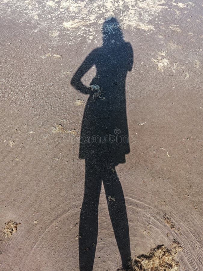 Female shadow at beach stock photo. Image of wall, black - 230568310