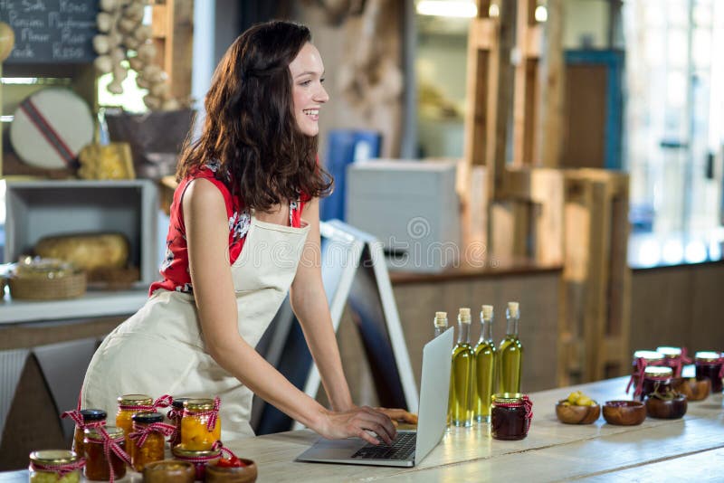 Female Shop Assistant Using Laptop Counter Grocery Shop Stock Photos ...