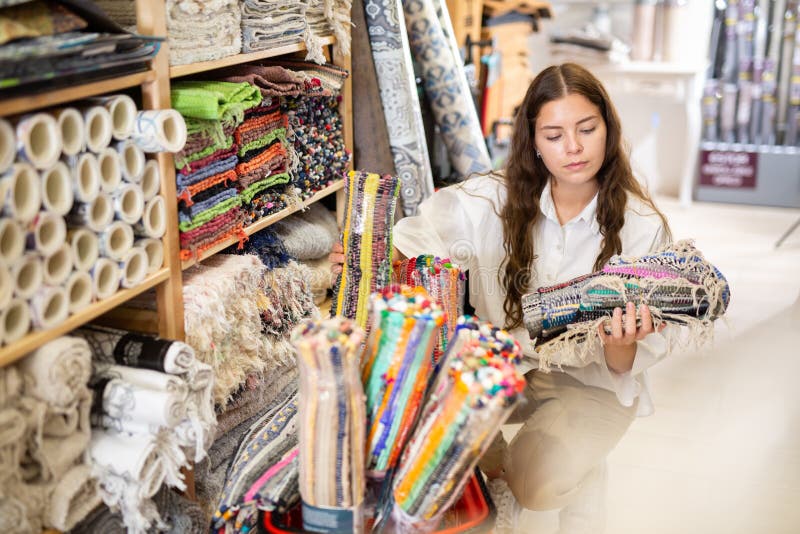 Female Shopper Chooses Floor Mat in Store Stock Image - Image of floor ...