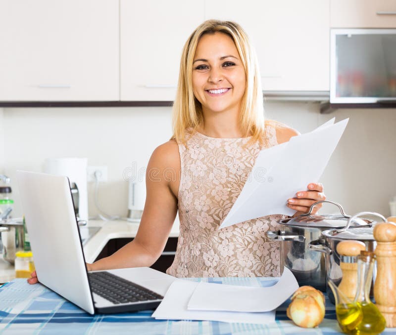 Female Signing Documents at the Kitchen Stock Image - Image of ...