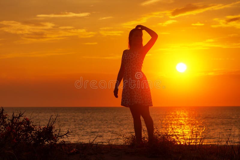 Female Silhouette at Sunset on the Beach, Hands Up Stock Image - Image ...
