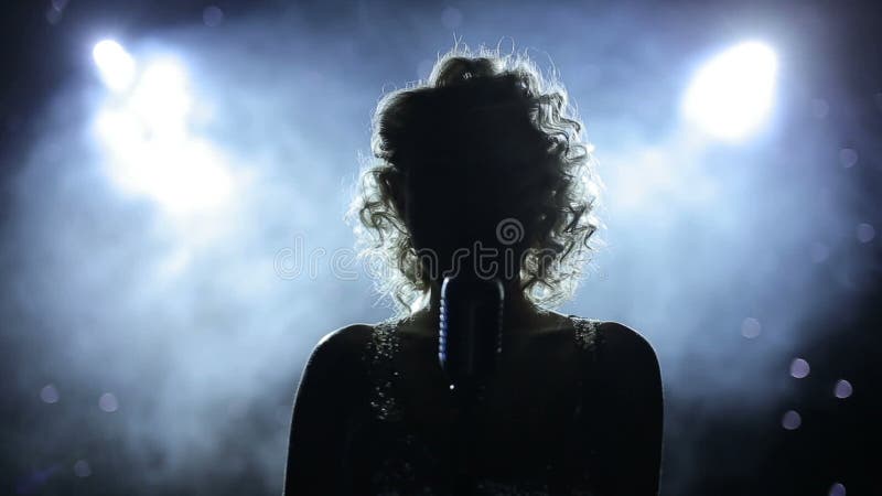 Female Singer Backlit on Smoky Stage Stock Video - Video of lights ...