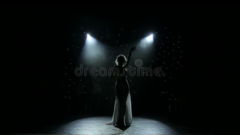 Female Singer Backlit on Smoky Stage Stock Footage - Video of adult ...