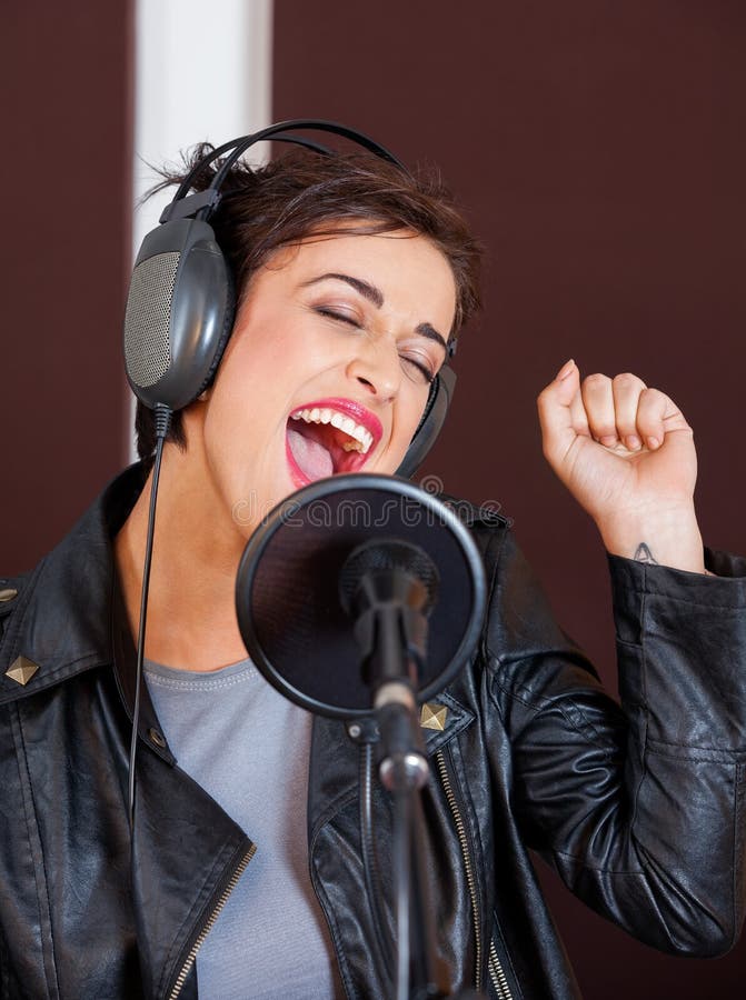 Female Singer Enjoying while Performing Stock Image - Image of jacket ...