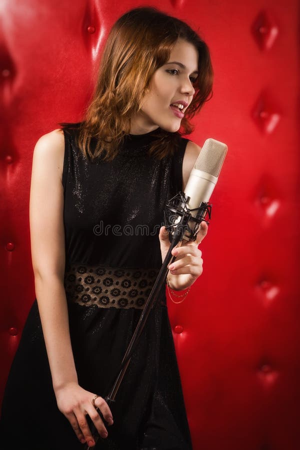 Female Singer with Microphone Stock Image - Image of performer, pose ...