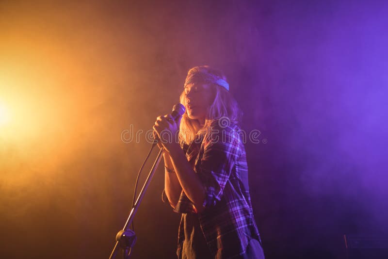 Female Singer Performing in Illuminated Nightclub Stock Photo - Image ...