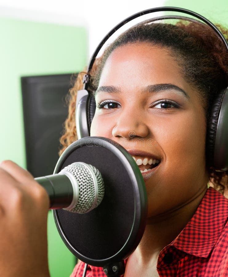 Female Singer Performing in Recording Studio Stock Image - Image of ...
