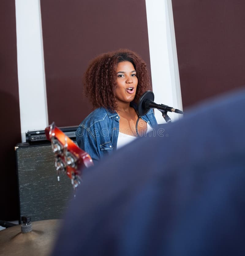 Female Singer Performing in Recording Studio Stock Photo - Image of ...