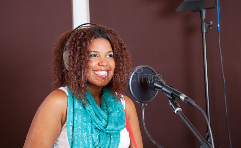 Female Singer Smiling while Performing in Studio Stock Image - Image of ...