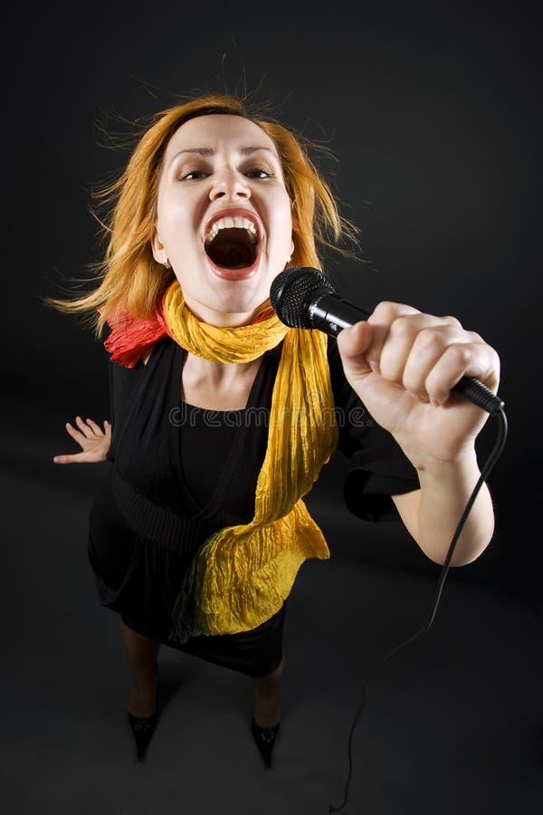 Female singing into mic stock photo. Image of brown, people - 11633142